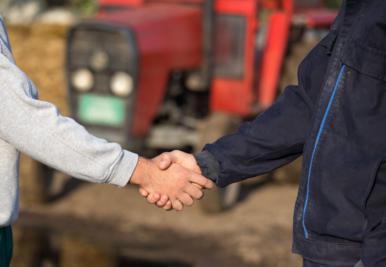 Farmers Shaking Hands On Farm - Farm Mortgage Loan